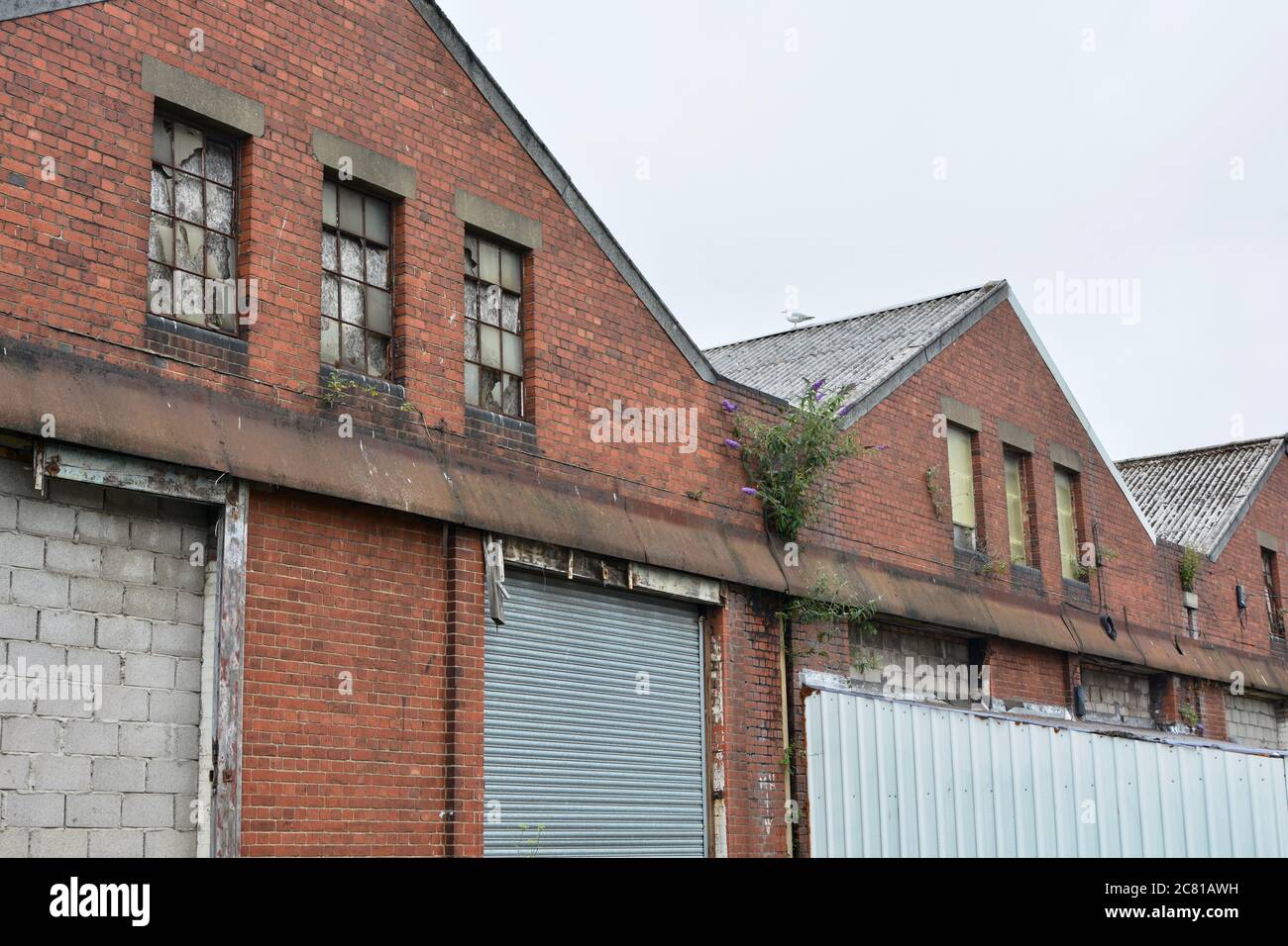 Derelict buildings on dock, old lock ups and storage units left empty ...