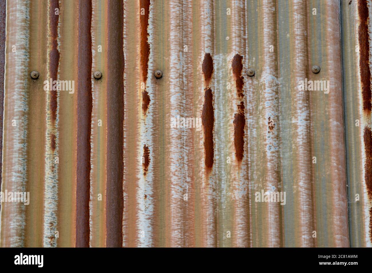 Corroded corrugated metal shutters, with paint rust and weathered ...