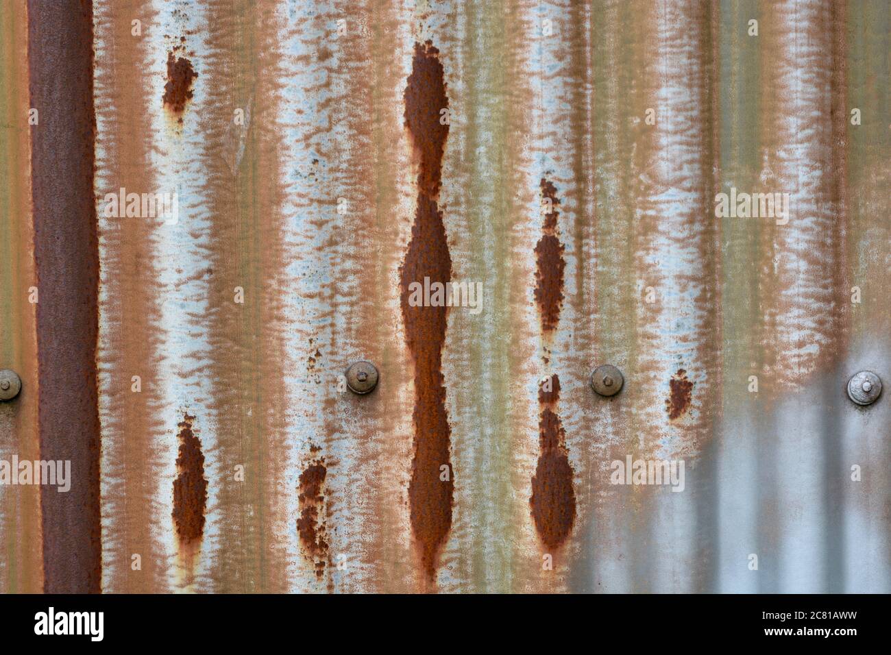 Corroded corrugated metal shutters, with paint rust and weathered ...
