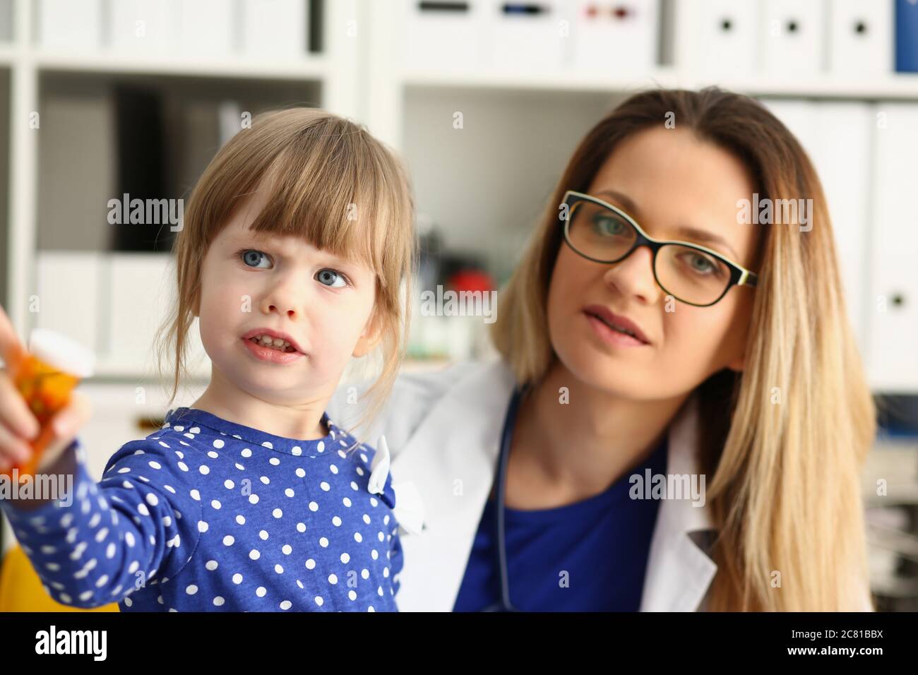 Little child in office being checked up by doctor Stock Photo - Alamy