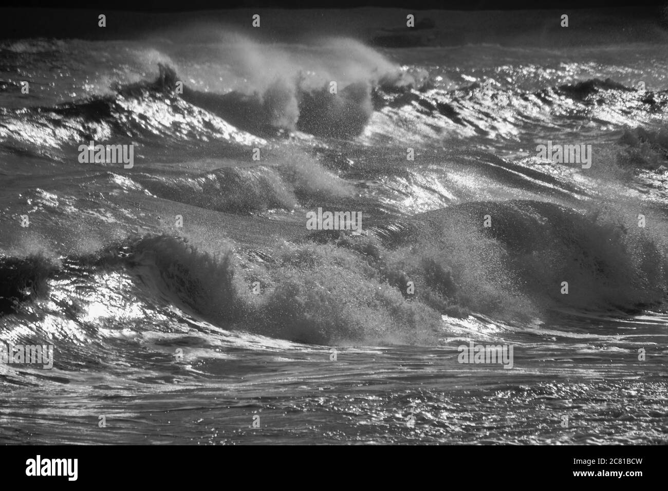 A stormy sea with gale force winds and the high tide creates huge waves ...
