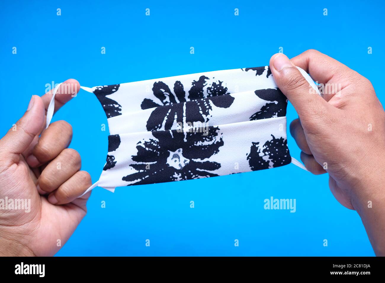 man's hand holding protective face mask top down Stock Photo - Alamy