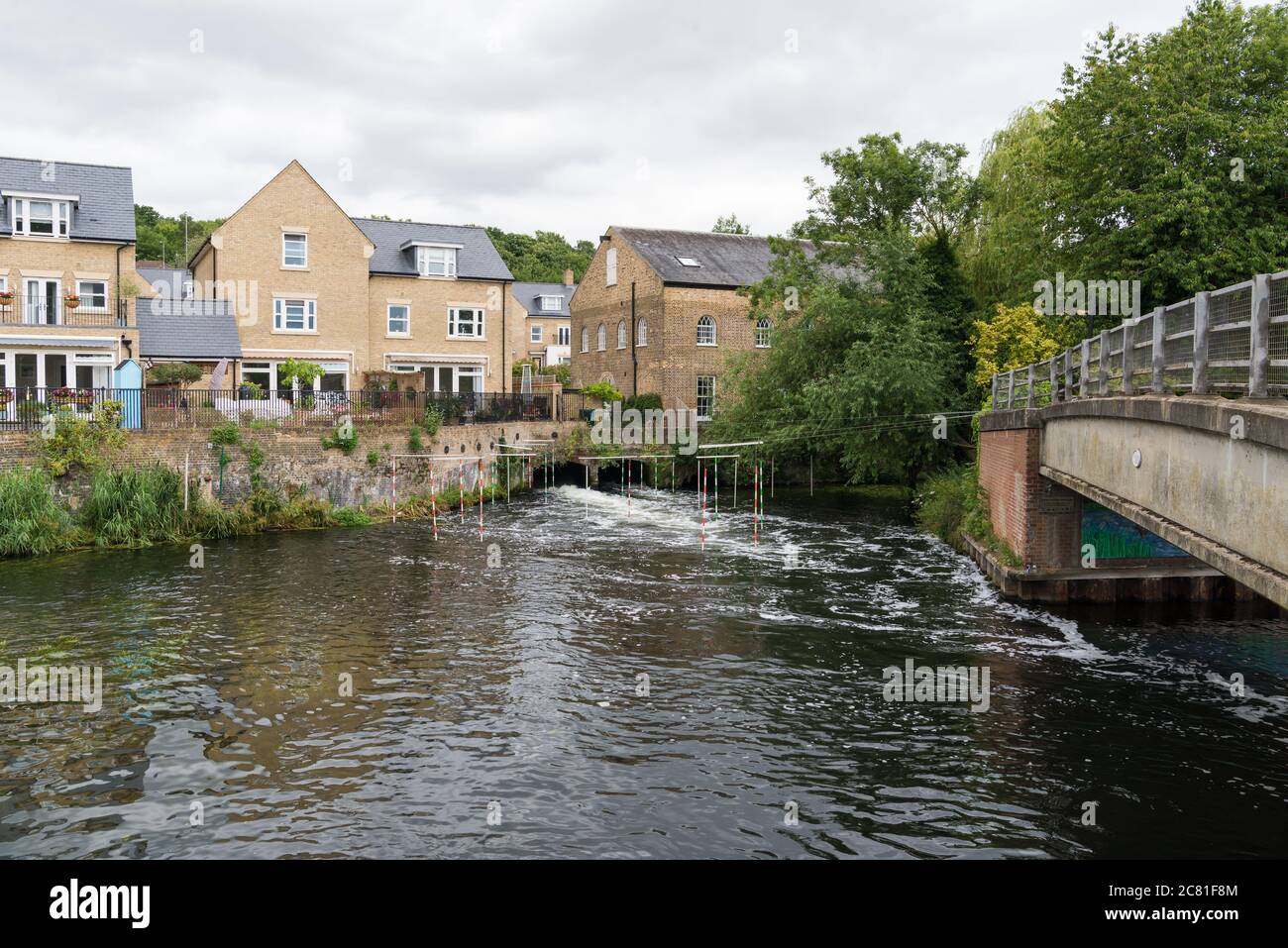 Water inflow into the Grand Union Canal, with canoe slalom practice ...