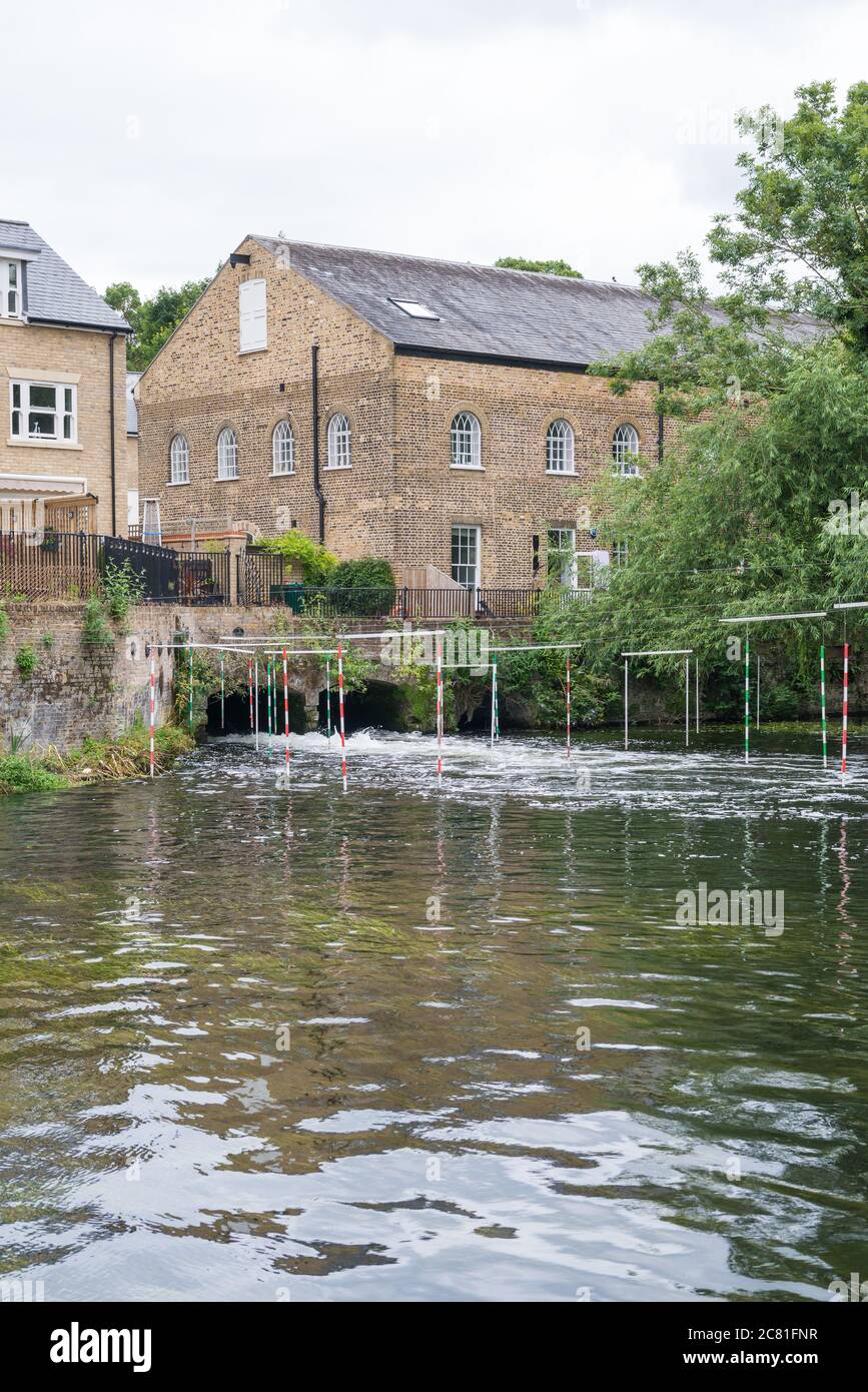 Water inflow into the Grand Union Canal, with canoe slalom practice ...