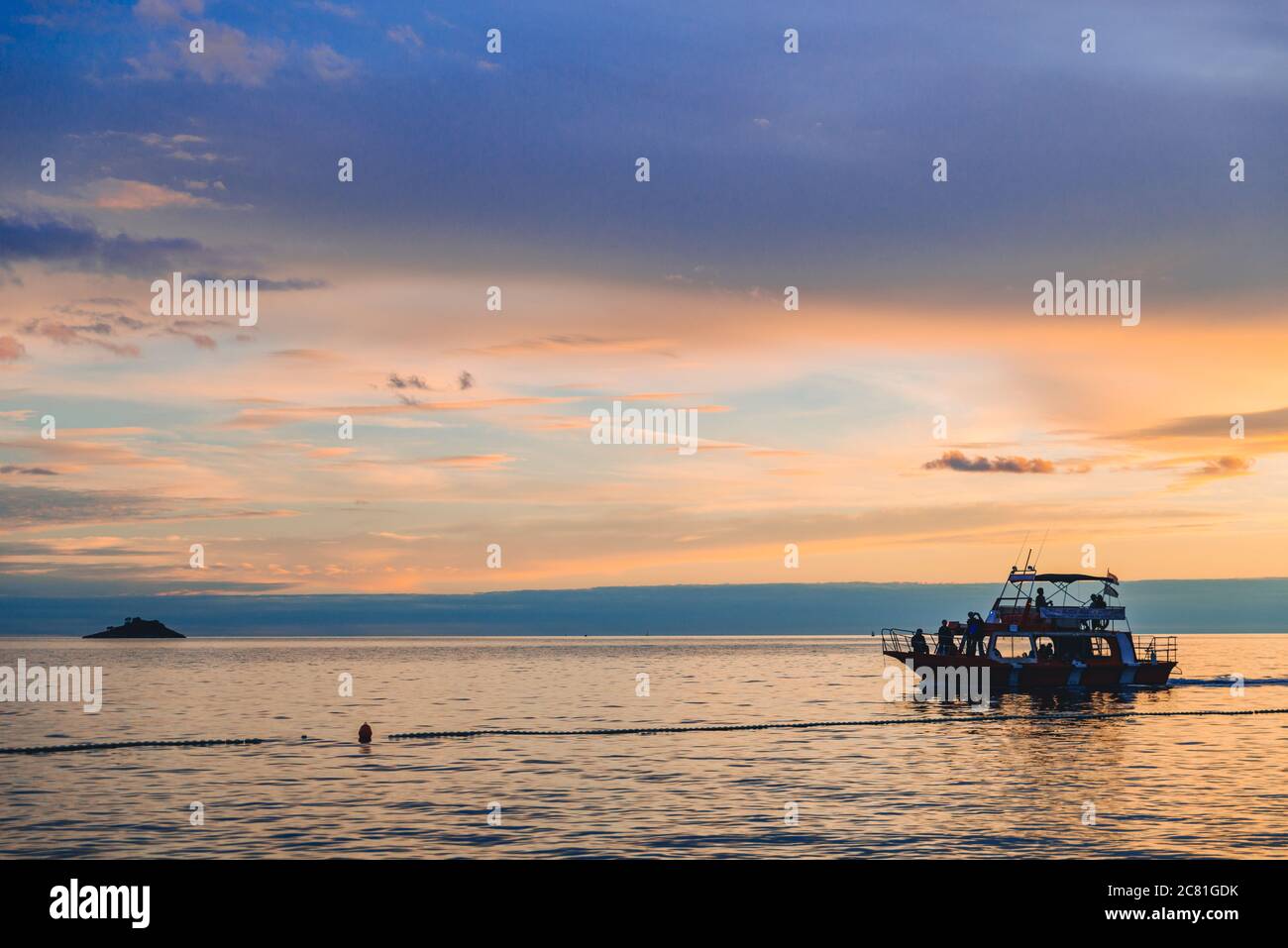 people on boat enjoying the view of sunset Stock Photo - Alamy