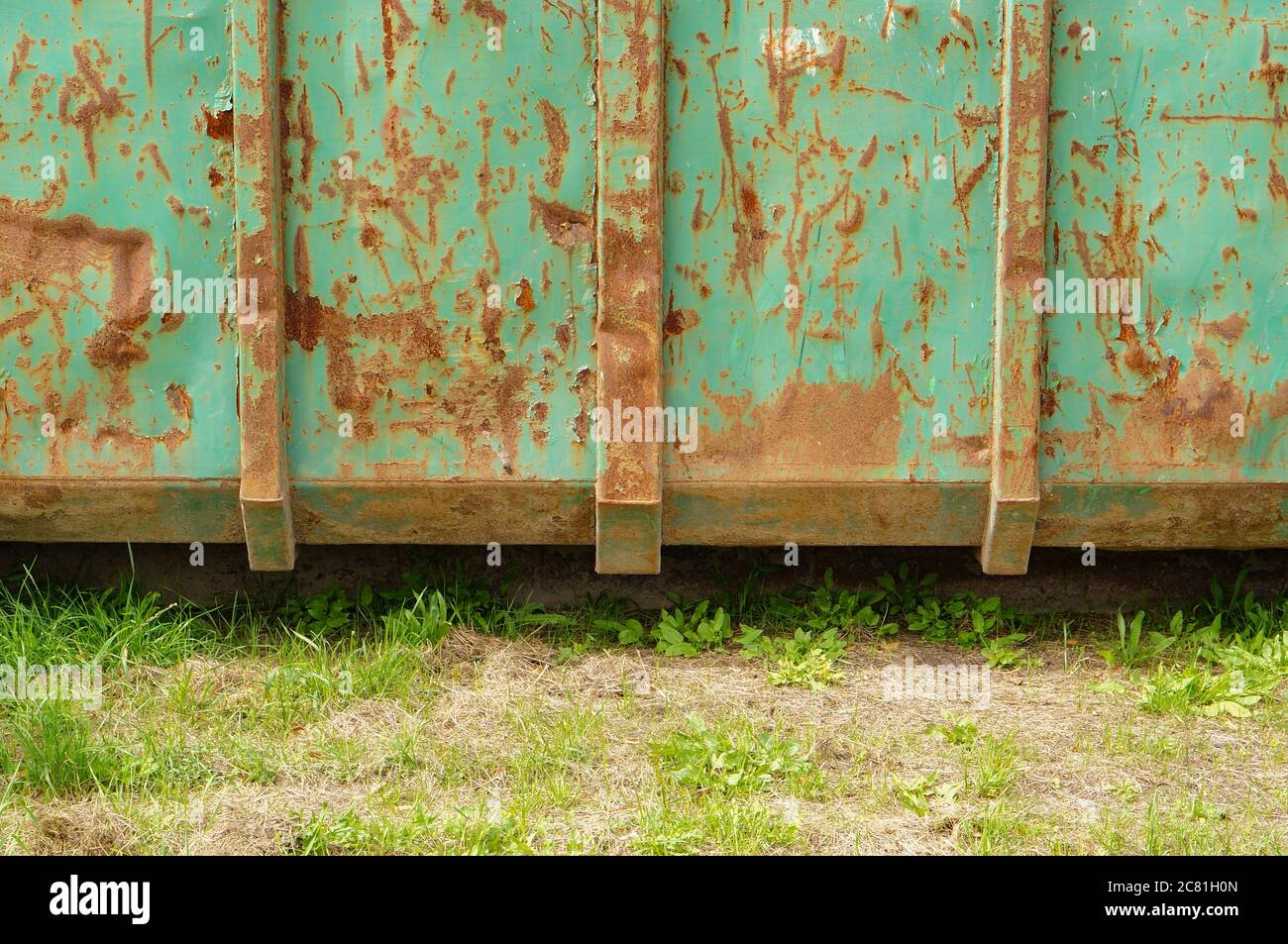 Old weathered and rusty green iron container on the ground Stock Photo ...