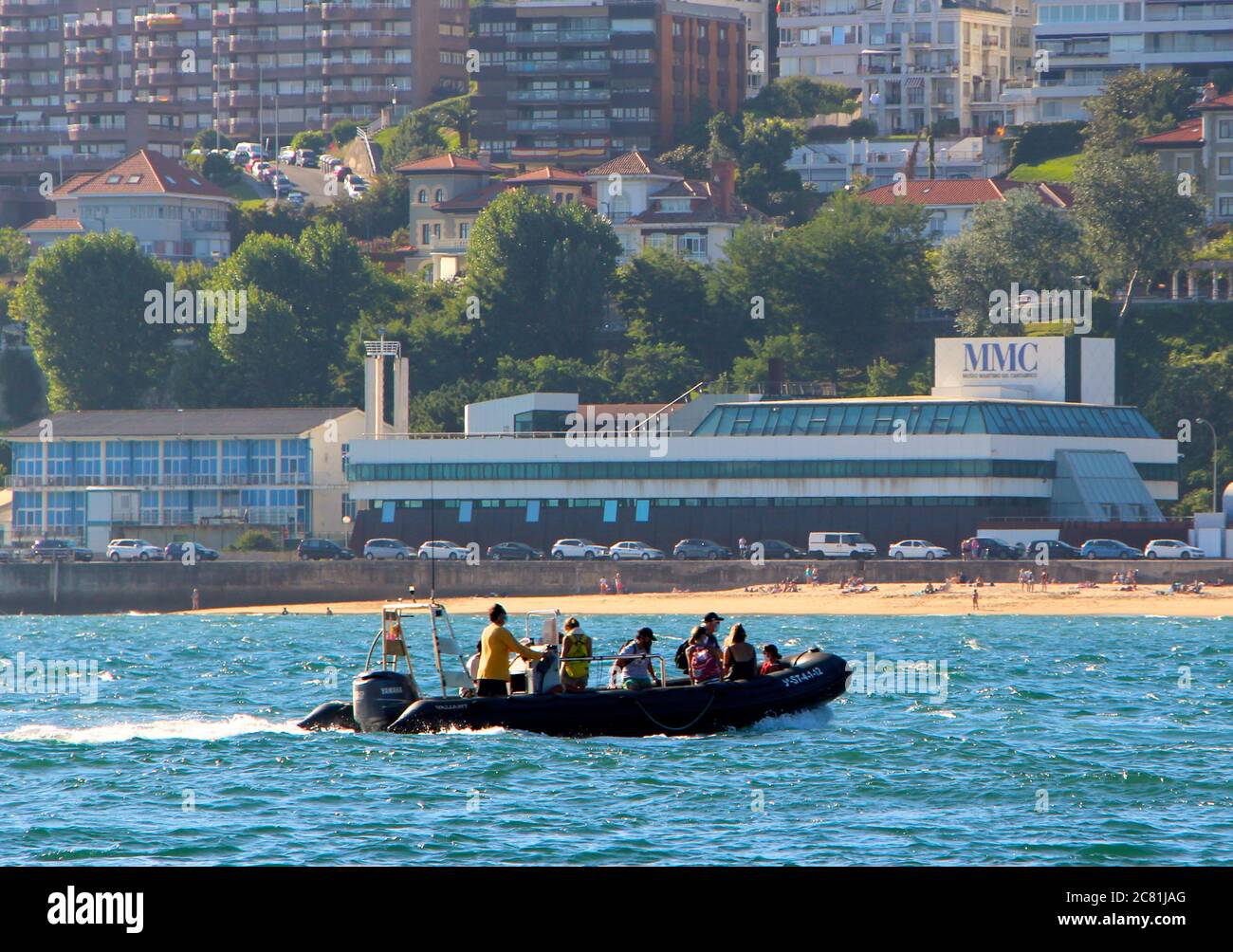 Dirigible boat full of people in the bay of Santander with the Maritime ...