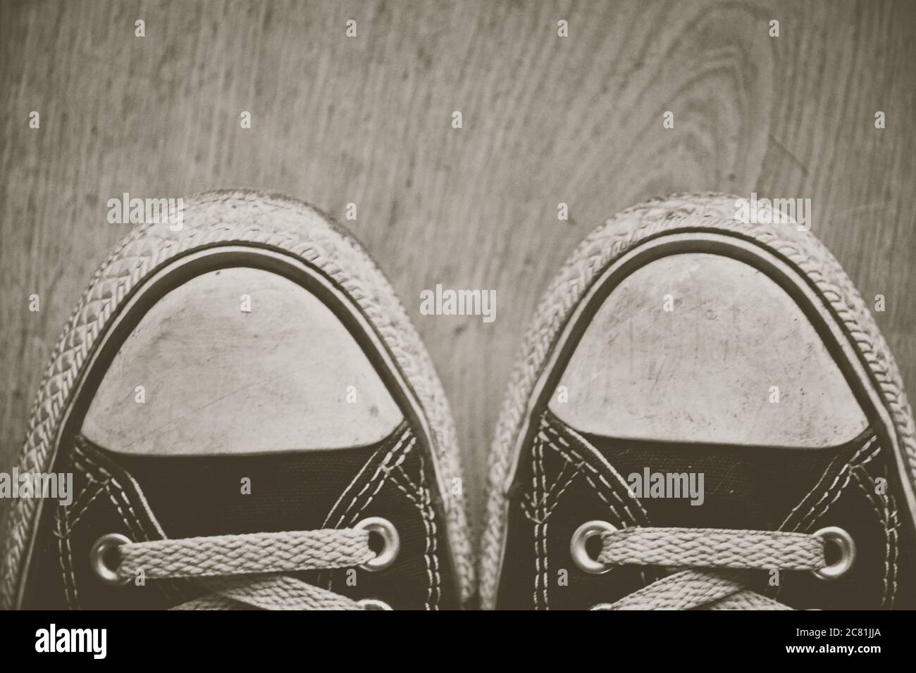 Grayscale top view shot of old and ages shoes Stock Photo - Alamy