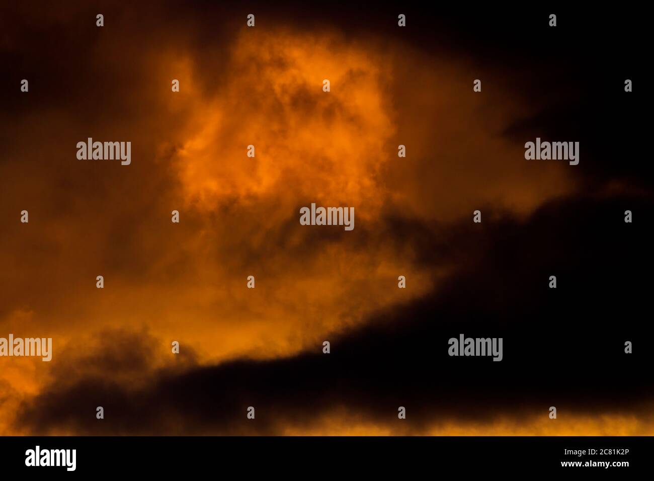 Colorful cloud patterns with golden hour light Stock Photo - Alamy