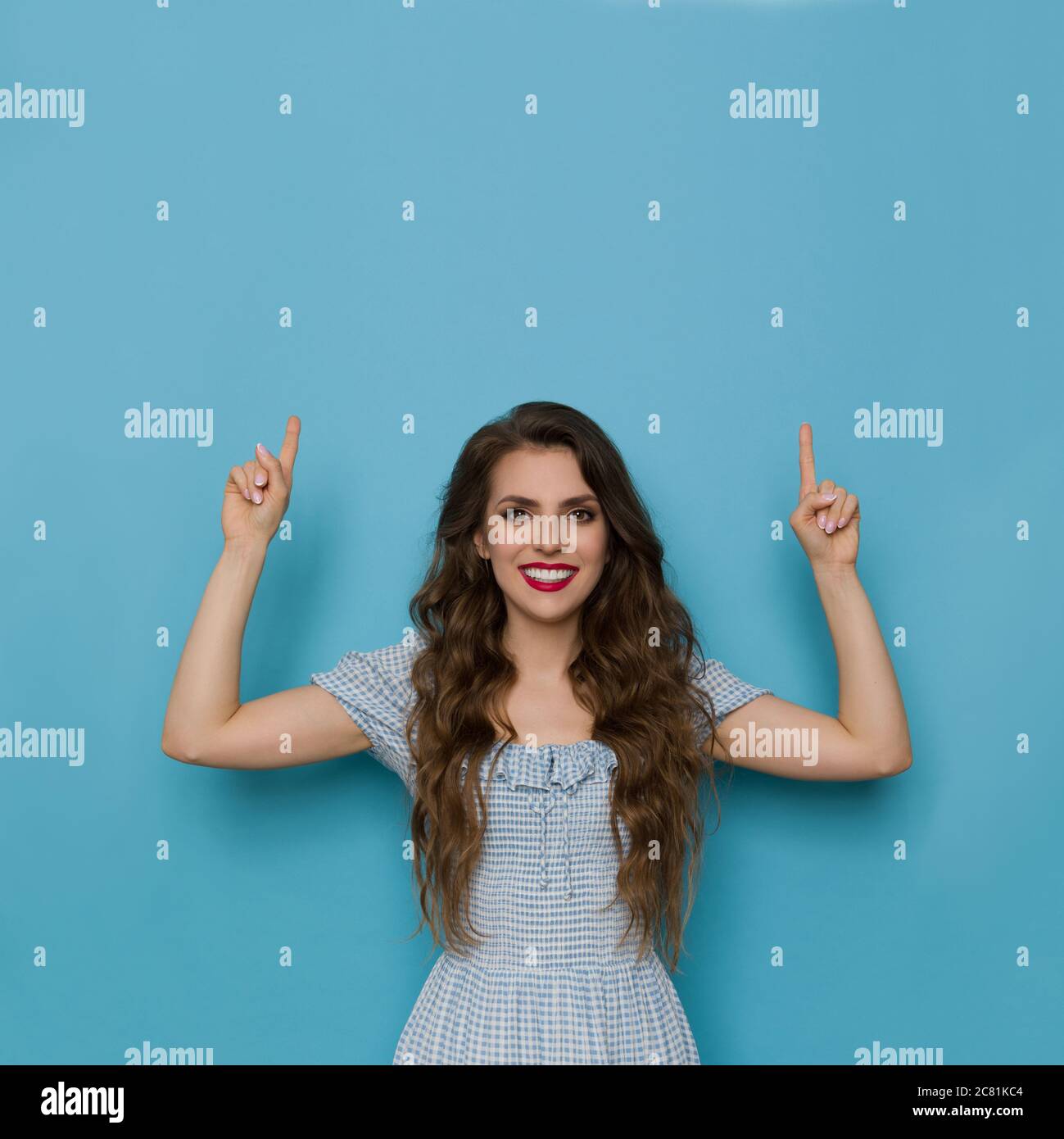 Girl holding arms above head hi-res stock photography and images - Alamy