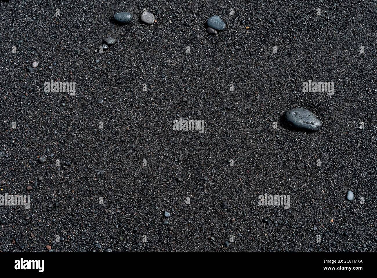 Black sand beach with pebble macro photography. Silky black beach ...