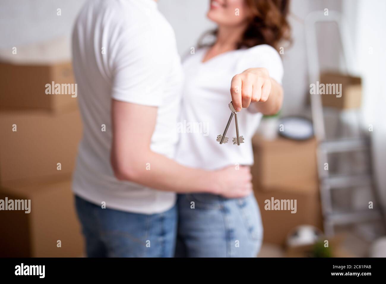 moving day and new life concept - keys of apartments in young couple ...