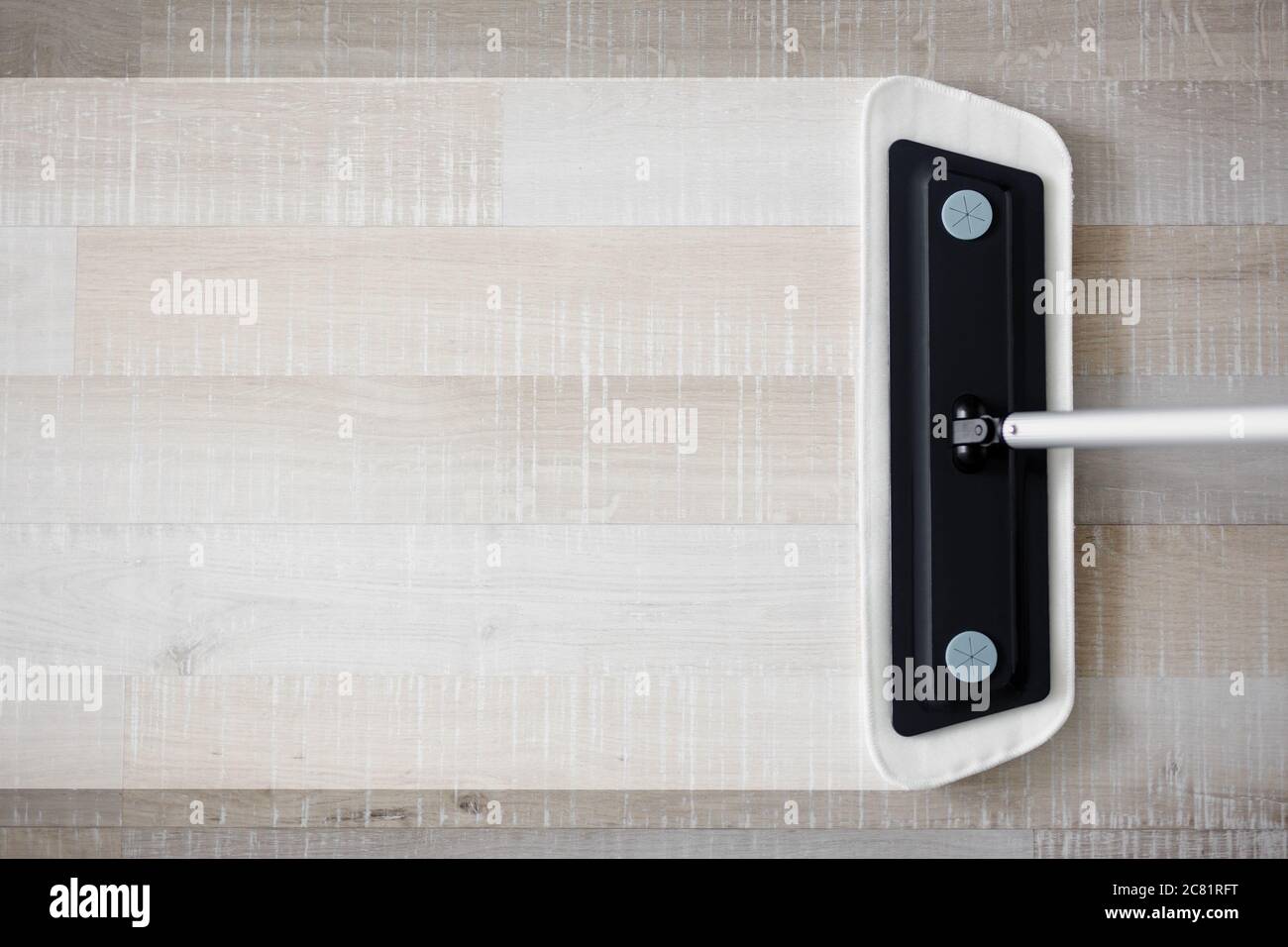 top view of cleaning wooden floor with mop - before and after cleaning ...