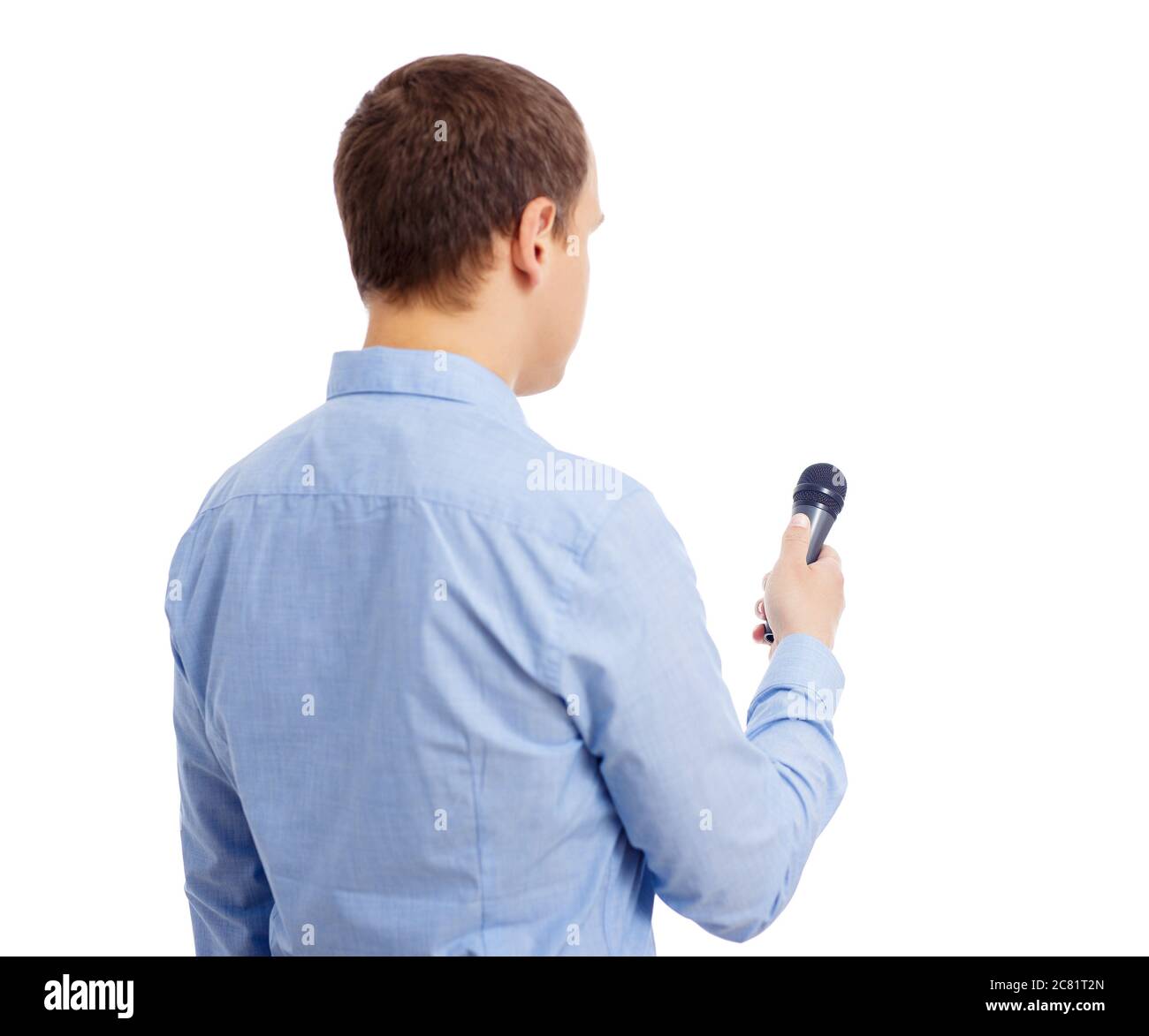 back view of male journalist or reporter with microphone interviewing ...