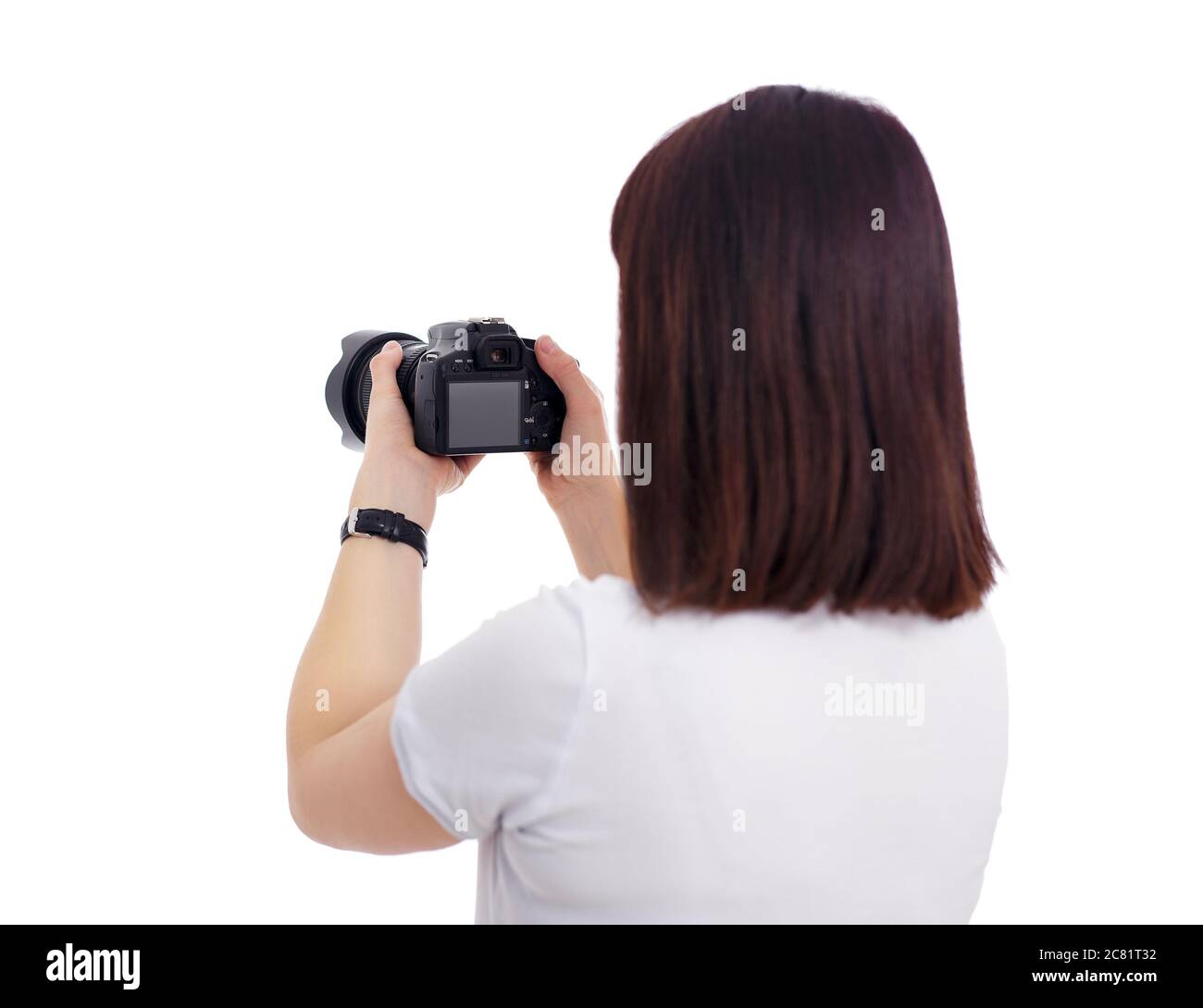back view of female photographer or videographer shooting video or ...