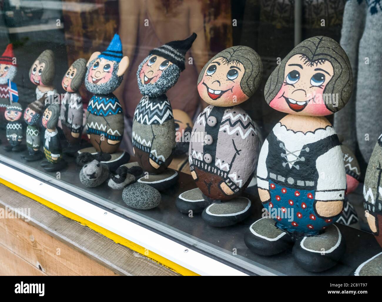 Icelandic dolls made of painted rocks on display in a row in a shop ...