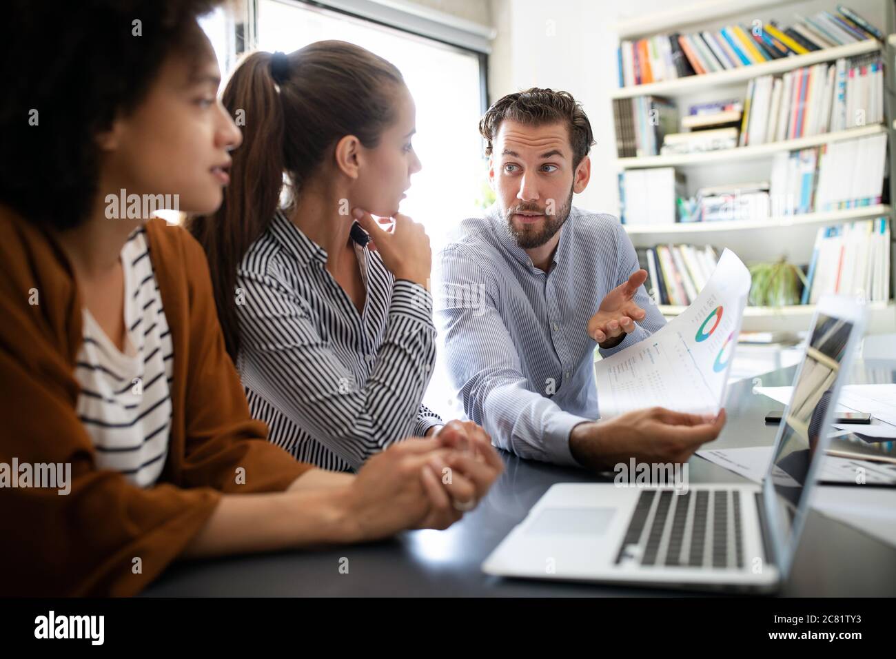 Programmers cooperating at IT company developing apps Stock Photo - Alamy