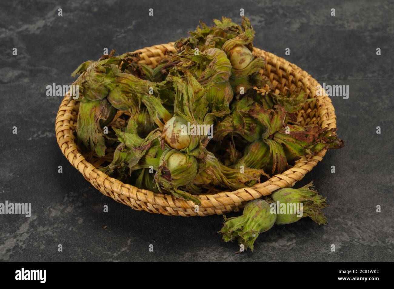 Young Hazel nuts in the basket Stock Photo - Alamy