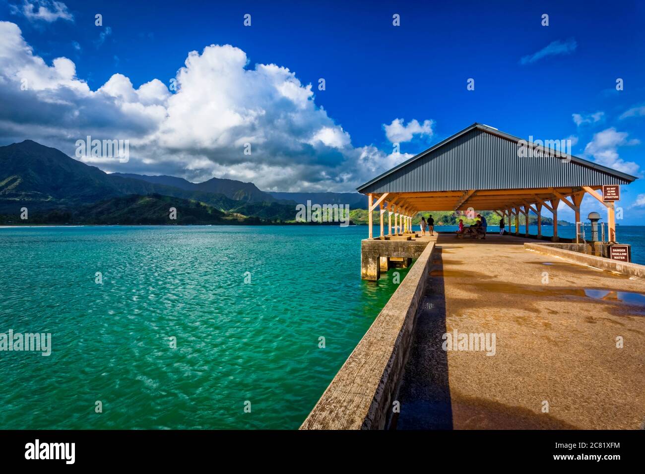 Hanalei Pier with tropical green water under blue sky, Hanalei Bay; Hanalei, Kauai, Hawaii ...
