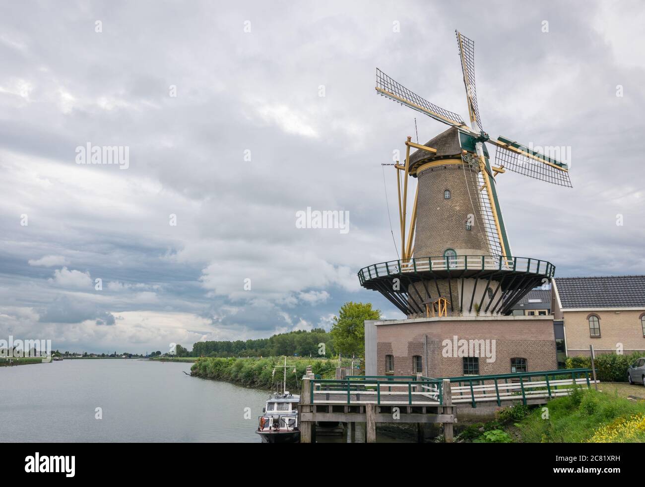Traditional dutch flour mill along river "Hollandsche IJssel" in the ...