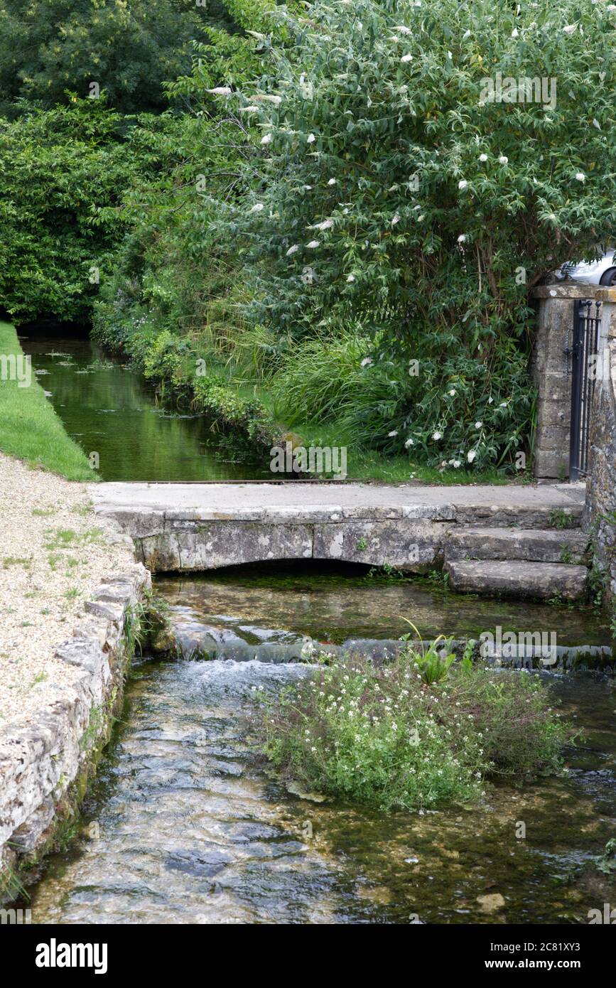 Stone bridge over a Brook, leading to a garden gate Stock Photo - Alamy