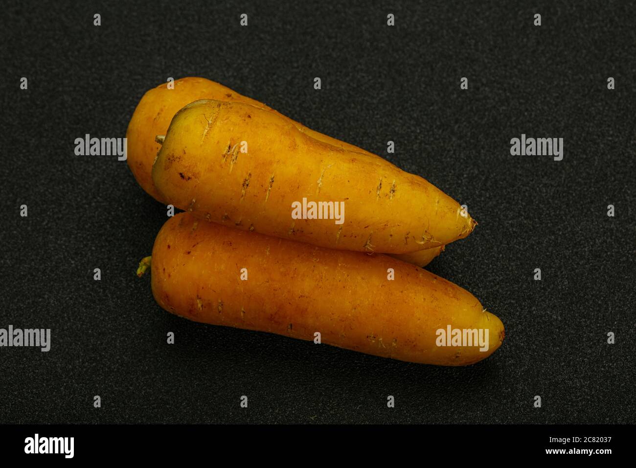 Natural vegan food - Raw Yellow carrot Stock Photo - Alamy
