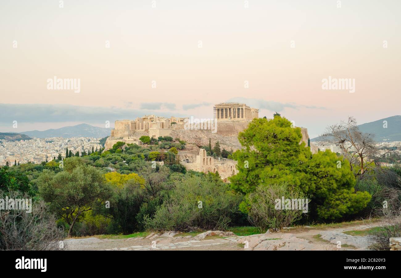 Acropolis with Parthenon. View through ancient marbles and cityscape ...