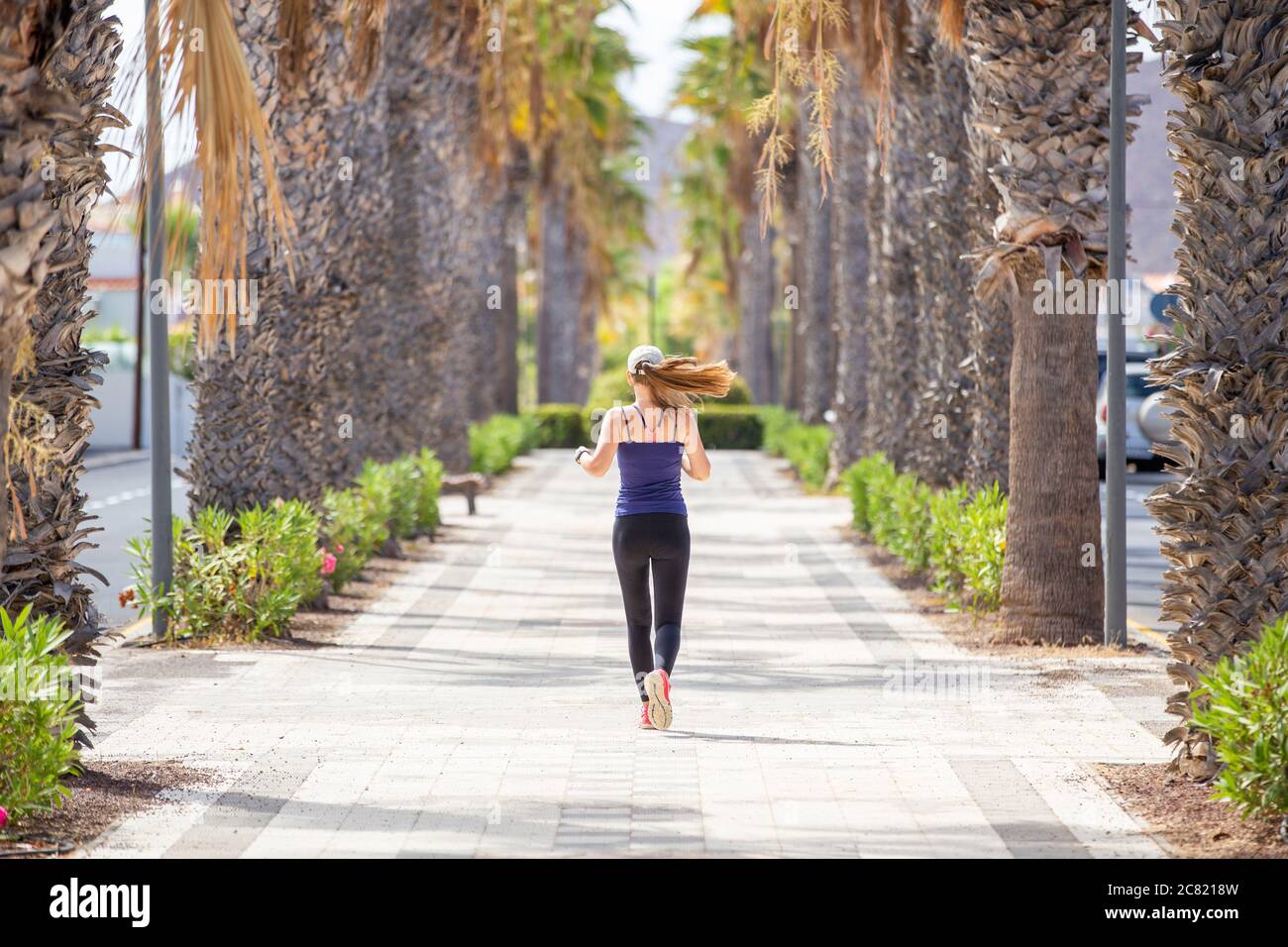 Back view sporty girl running hi-res stock photography and images - Alamy