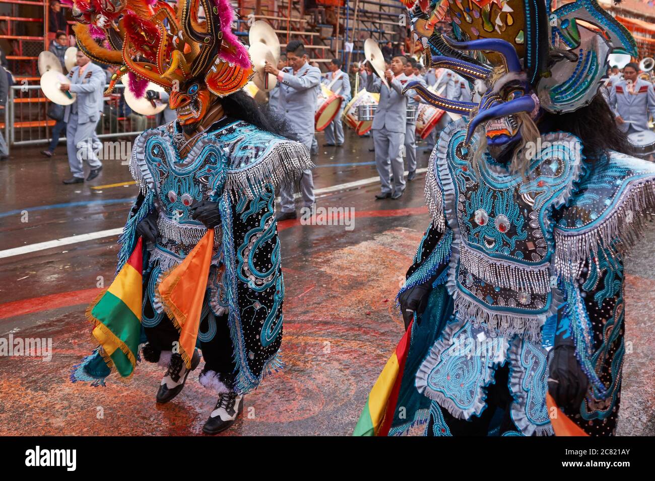 Diablada dancers in ornate costumes parade through the mining city of ...