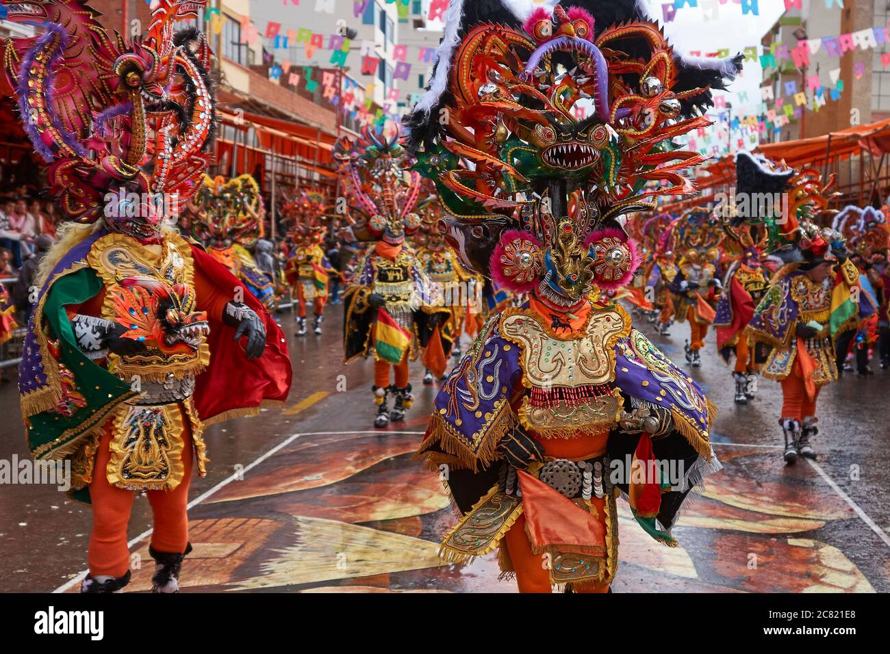 Diablada dancers in ornate costumes parade through the mining city of ...