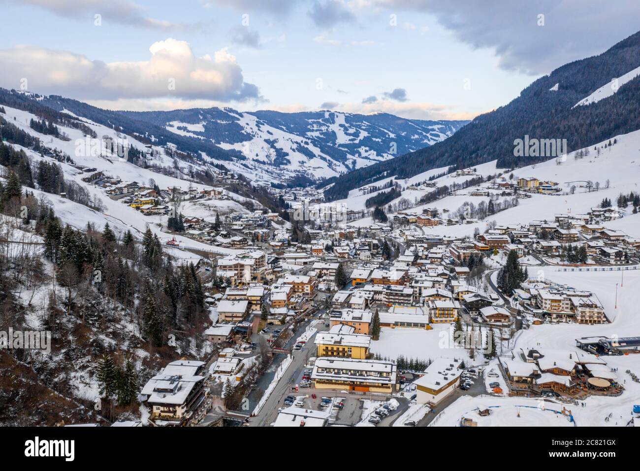 Aerial shot of a snowboarding resort in the snow under the sunlight ...