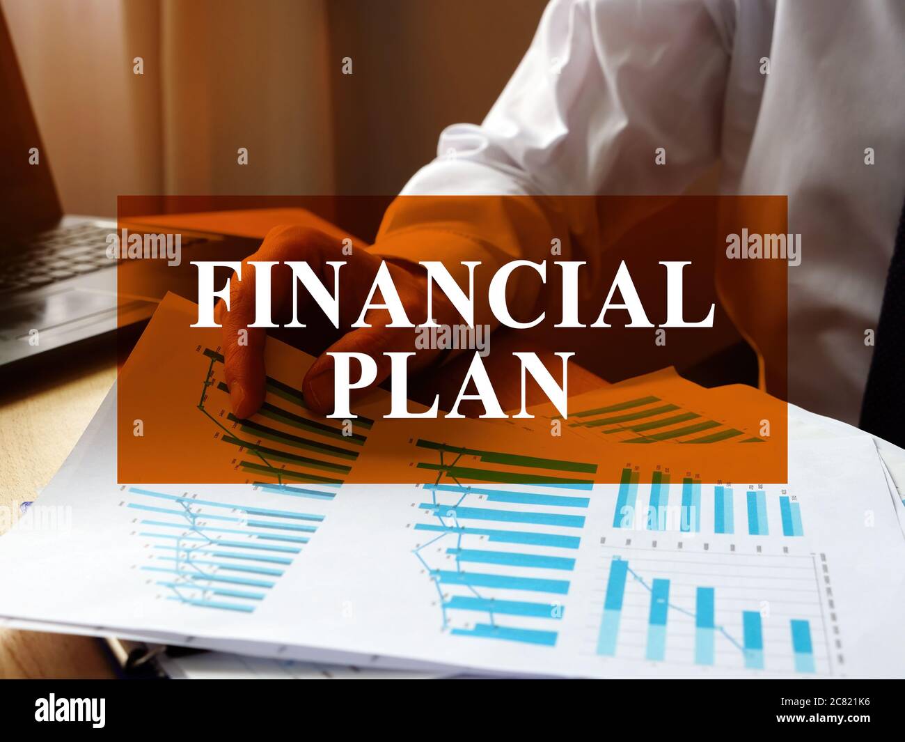 Financial plan concept. Businessman works with papers Stock Photo - Alamy