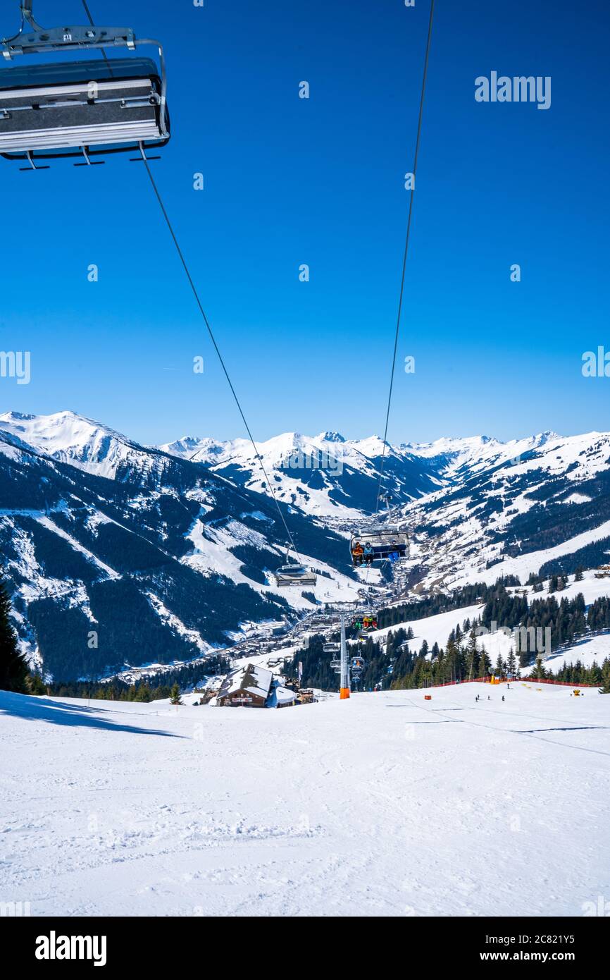 Vertical shot of a snowboarding resort in the snow under the sunlight ...