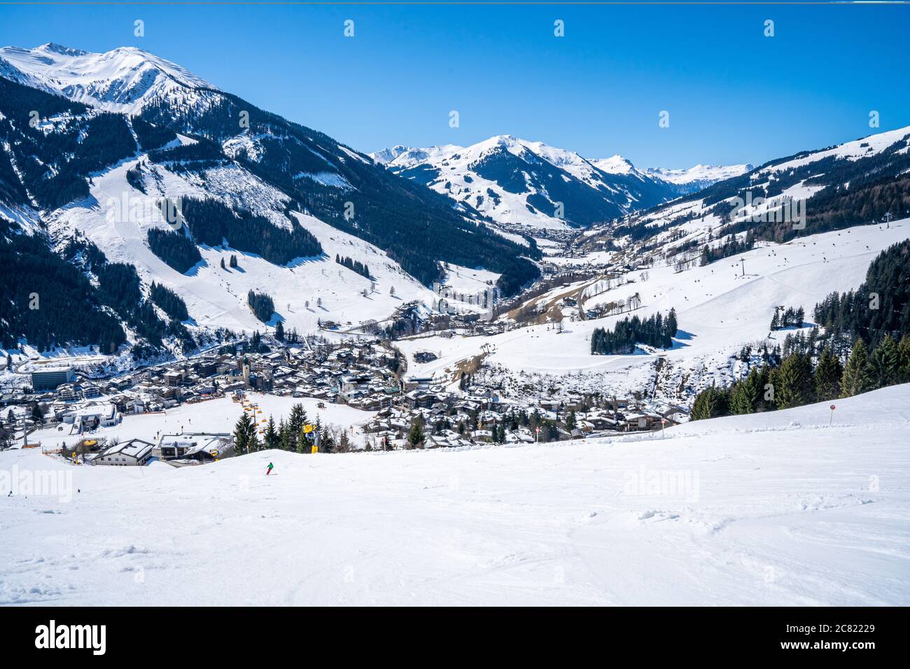 Aerial shot of a snowboarding resort in the snow under the sunlight ...