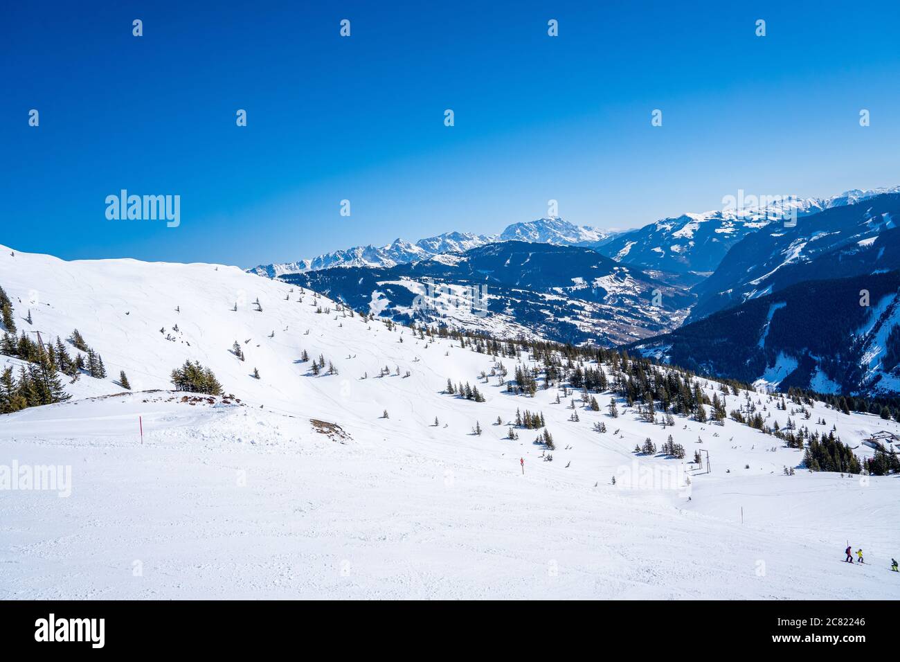 Aerial shot of a snowboarding resort in the snow under the sunlight ...