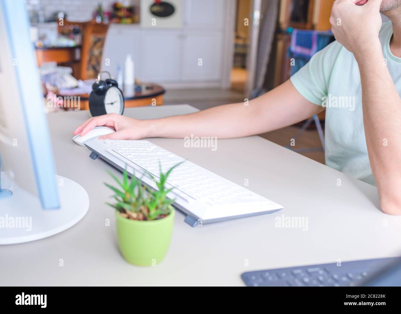 the developer works at the computer, typing, uses the mouse. Selective ...