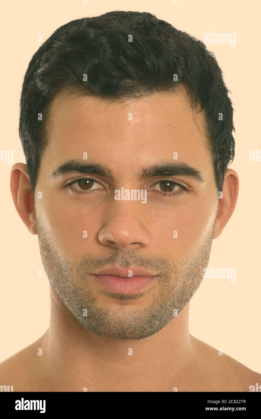 Face of young handsome Hispanic man with beard stubble Stock Photo - Alamy