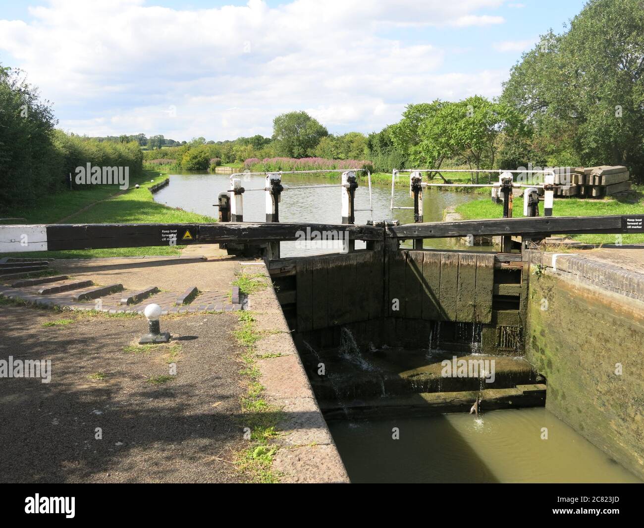 View of a lock gate on the Grand Union Canal showing the difference in ...