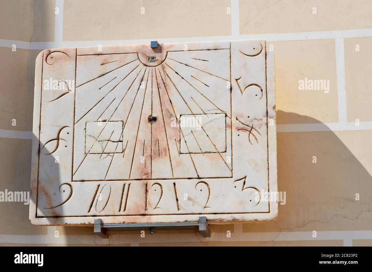 Medieval sundial on wall the house, Evora, Portugal Stock Photo - Alamy