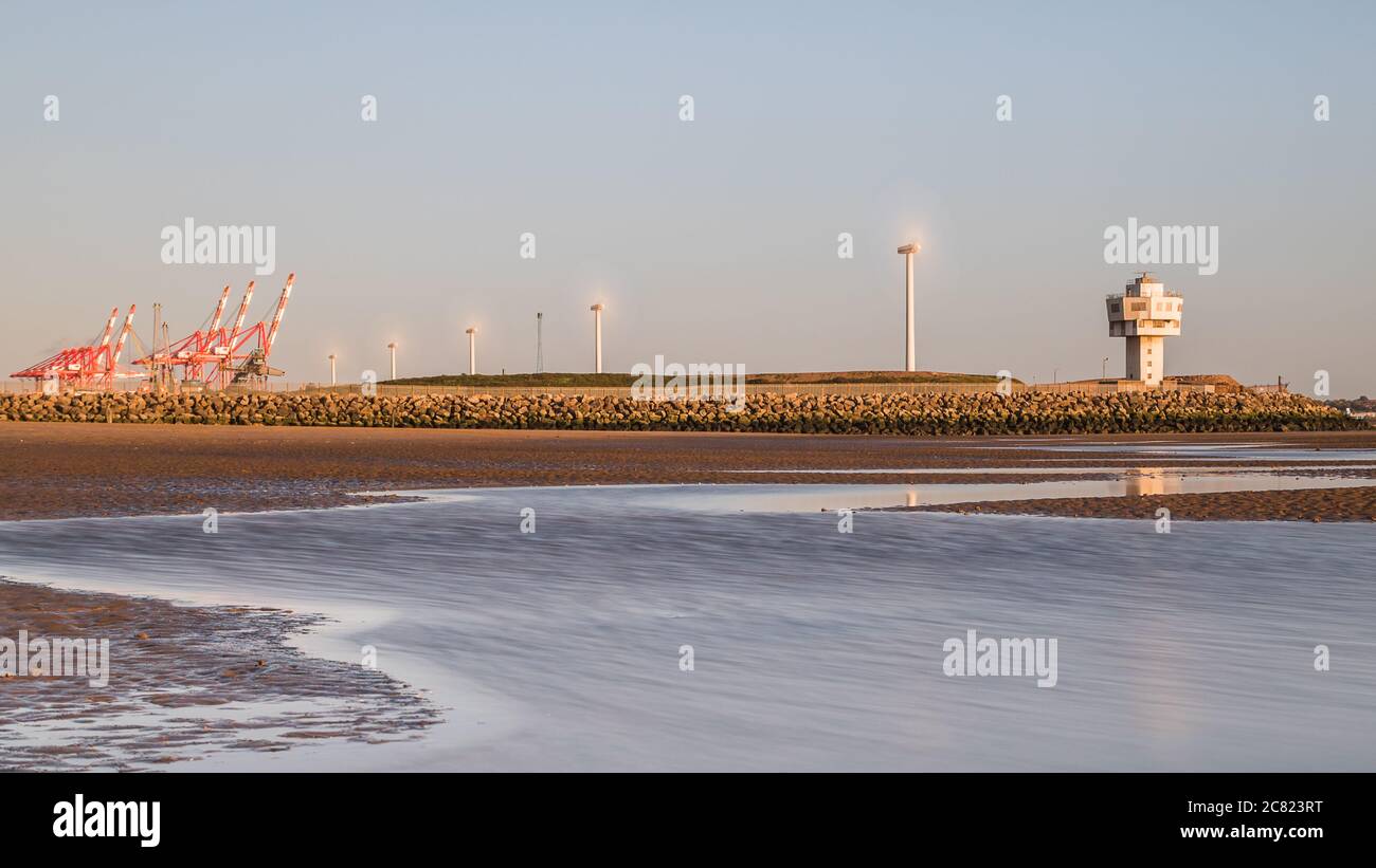 Wide channels of water at Crosby beach near Liverpool (England) in July ...