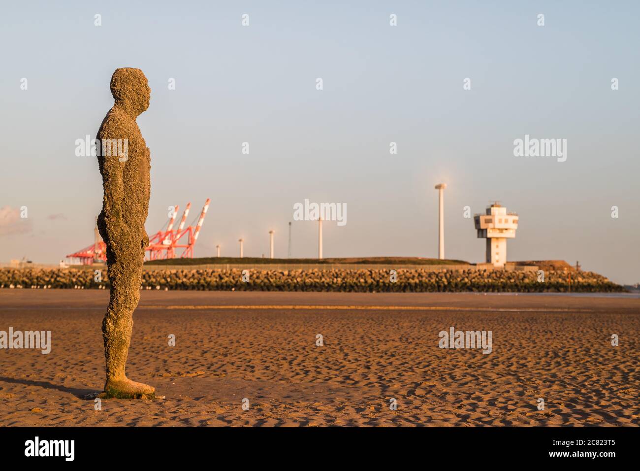 An Iron Man statue on seen on the beach at Crosby near Liverpool ...