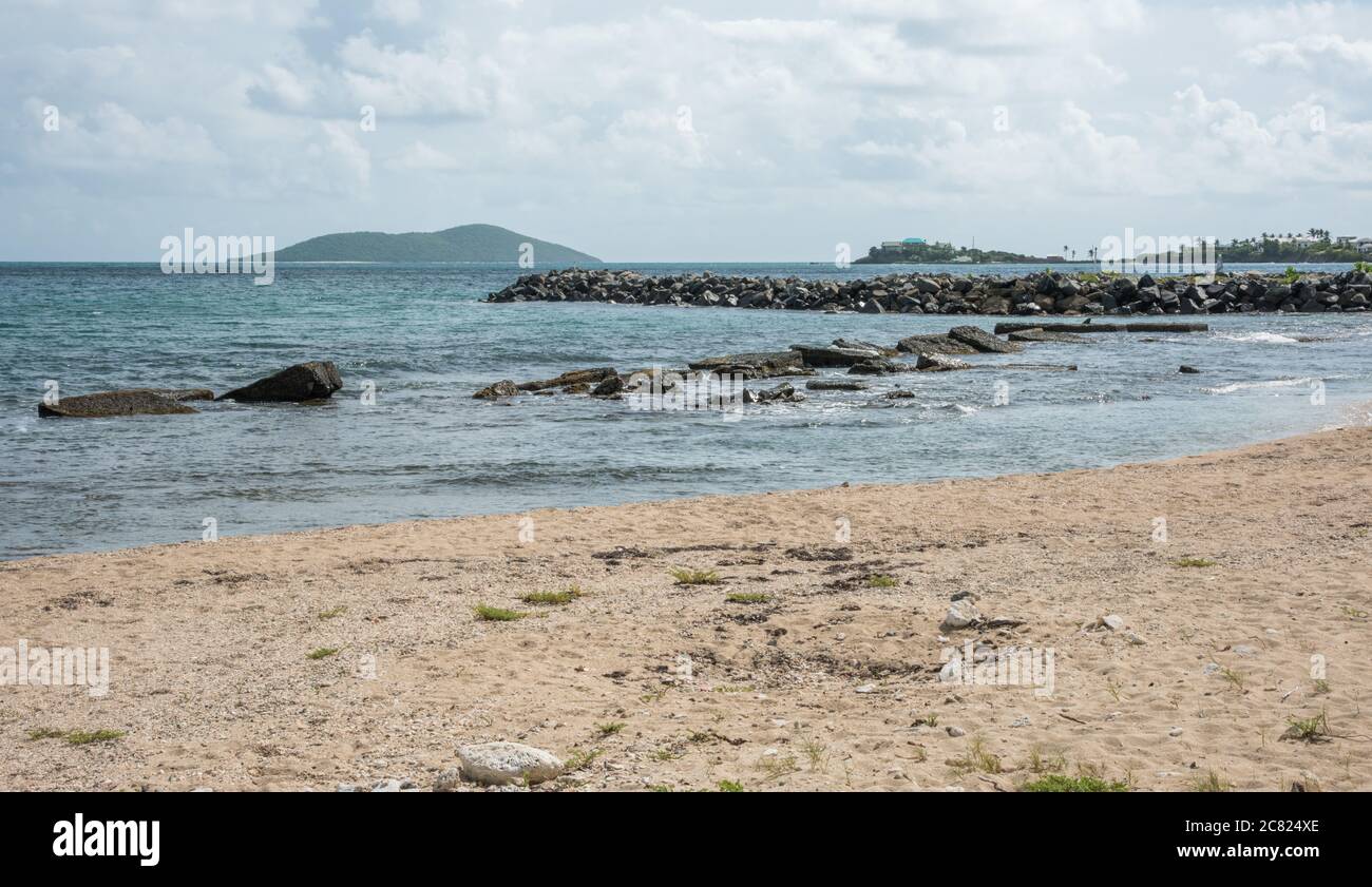 Rocky beach and rock groyne in the Caribbean Sea off the coast of St ...