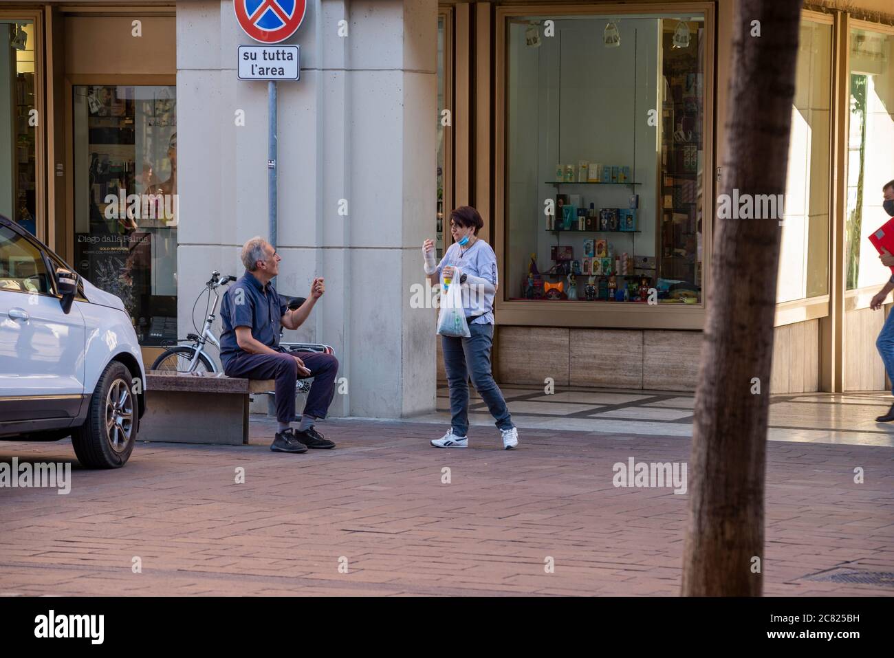 terni, italy july 20 2020:a woman and a man holding covid spacing Stock ...