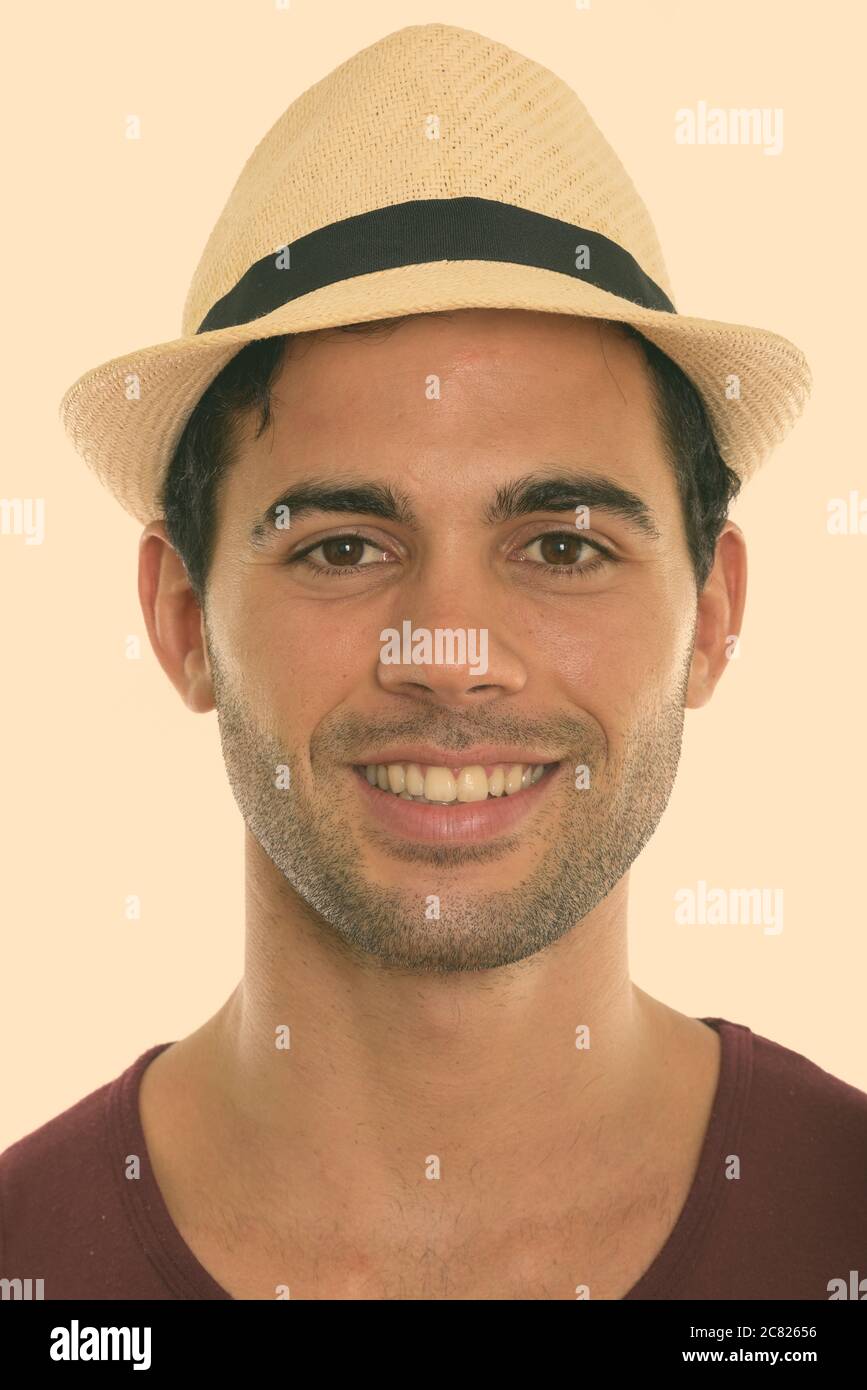 Face of young happy Hispanic man smiling Stock Photo - Alamy