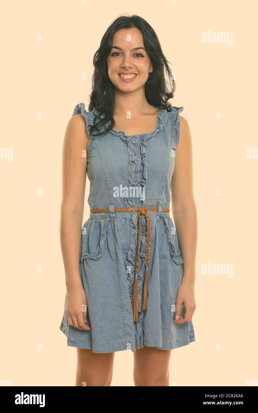 Studio shot of young happy beautiful Spanish woman smiling Stock Photo ...