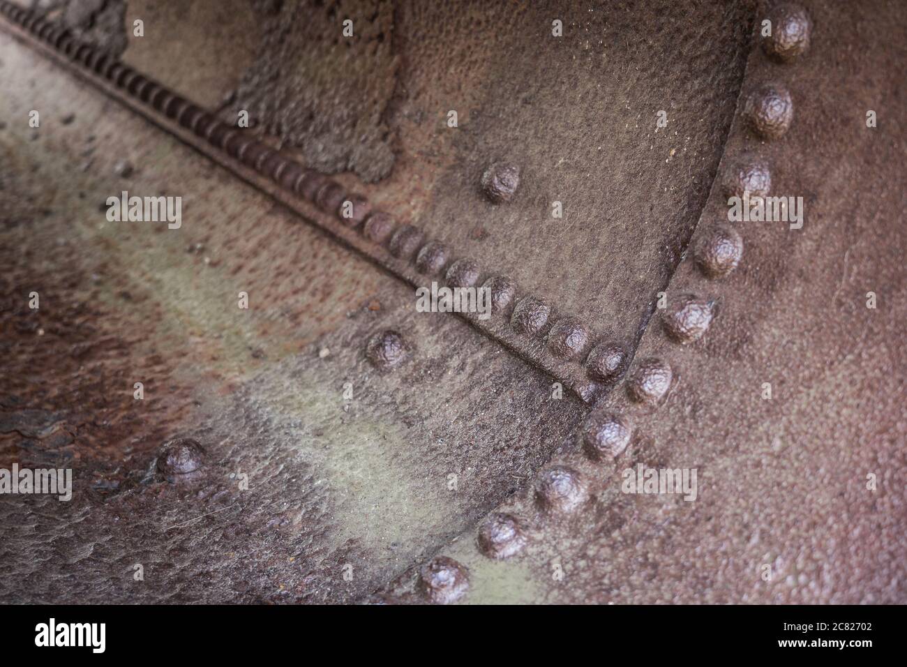 rusted metal plate structure with rivets Stock Photo - Alamy
