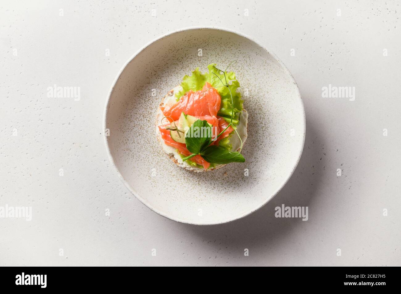 Puffed rice cake with different toppings friuts and vegetables on white ...