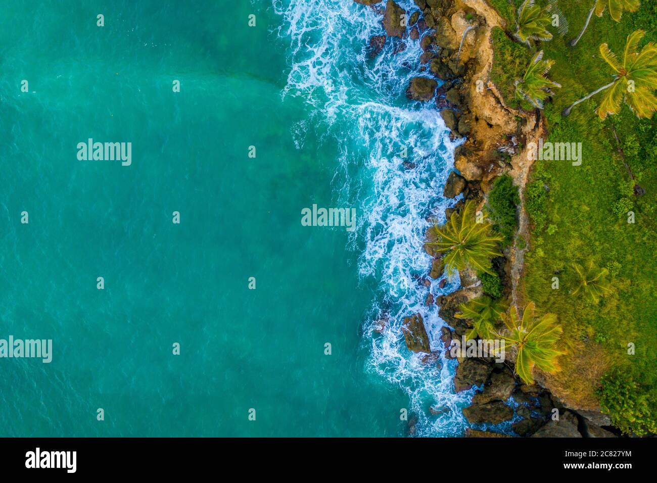 Aerial beautiful shot of an island seashore with a sea on the side ...