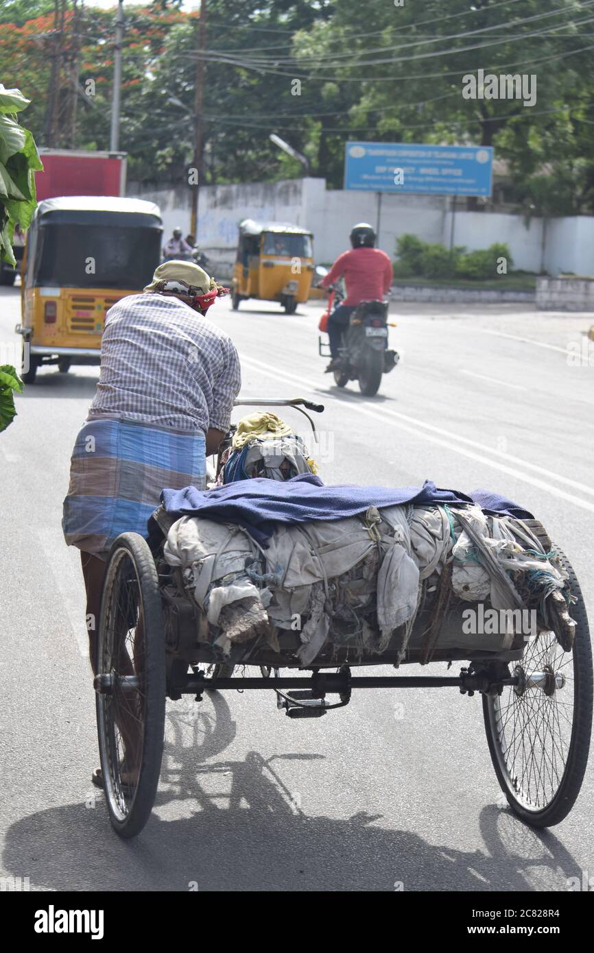 Man pulling cart hi-res stock photography and images - Alamy