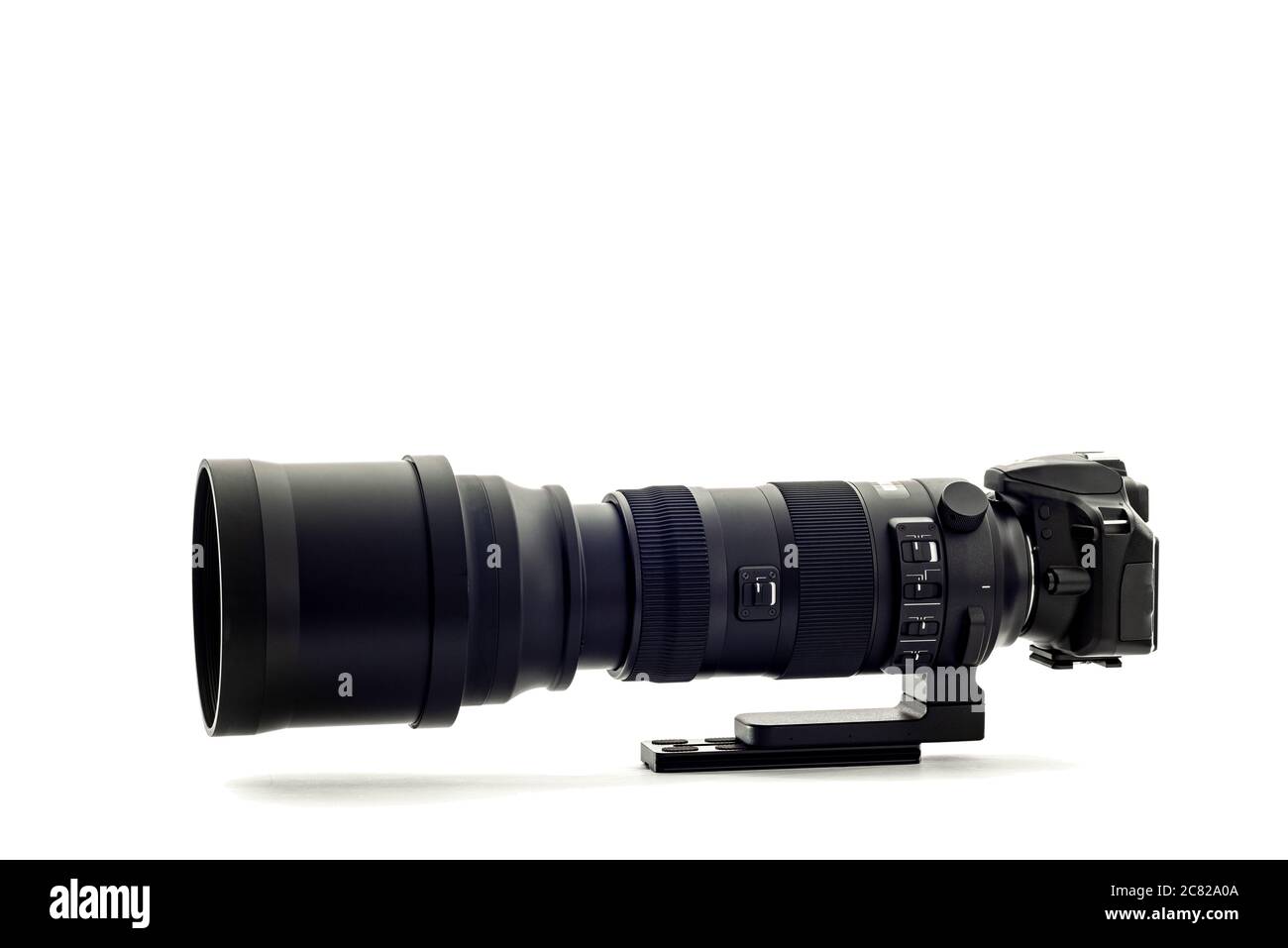Horizontal shot of a modern DSLR camera with super telephoto zoom lens ...